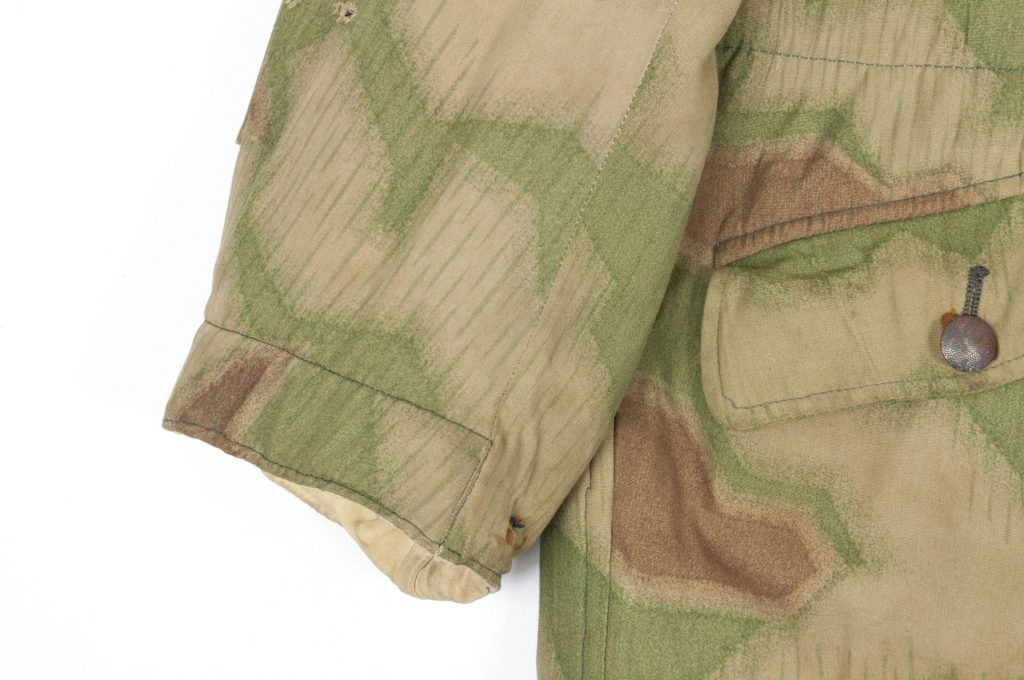 Reversible “Sumpftarn” winter parka with swamp camouflage pattern