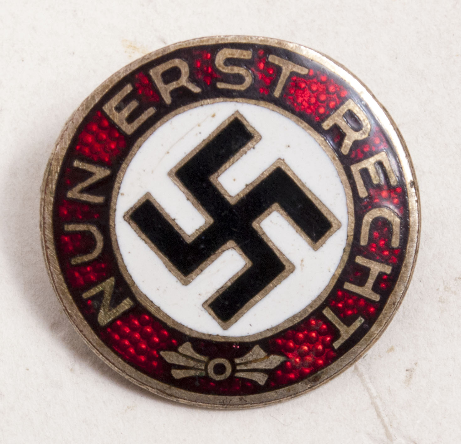 (Slogan) Full size NSDAP “Nun Erst Recht” badge (double Ges Gesch)